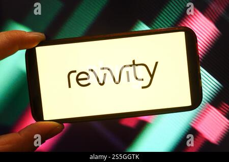 In this photo illustration, the Revvity logo is seen displayed on a ...