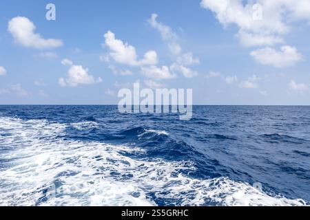 splash of ship water trails cutting through calm sea from top Stock ...
