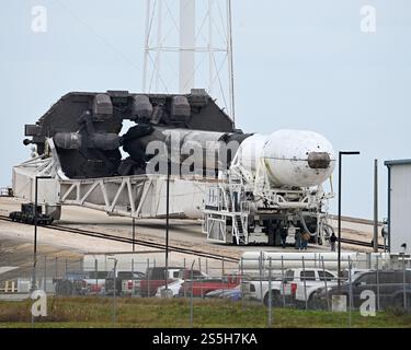 A SpaceX Falcon 9 rocket rolls from its horizontal integration facility to Pad 39A in ...