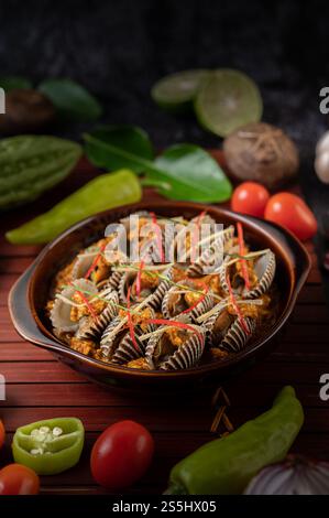 Cockles sauteed in curry powder with bell peppers and tomatoes Stock ...