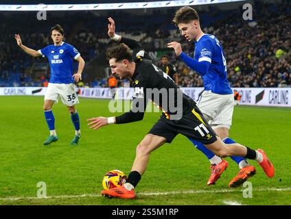 Cardiff City's Cian Ashford (left) battles for the ball with Derby ...