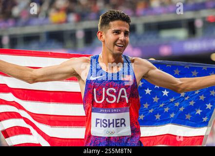 Grant Fisher celebrating her medal with her country's flag at the Paris ...