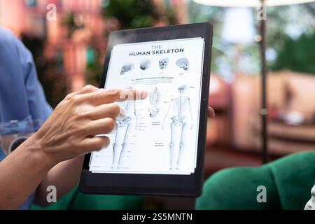 Female osteopath discussing about spinal cord tension diagnosis to ...