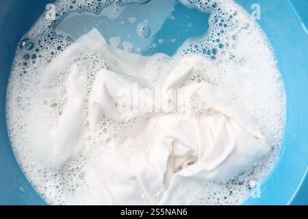 Soak a cloth before washing, white cloth. Top view Stock Photo - Alamy