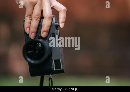 hand holding digital camera, traveling concept Stock Photo - Alamy