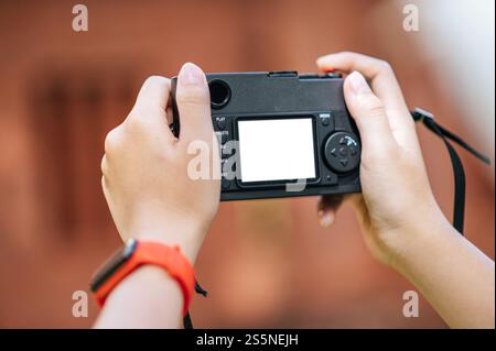 hand holding digital camera, traveling concept Stock Photo - Alamy