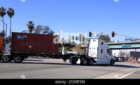 Freight Truck carrying a BEACON shipping container on a street toward ...