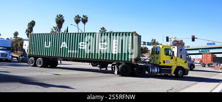 Freight Truck carrying an UASC shipping container on a street toward ...