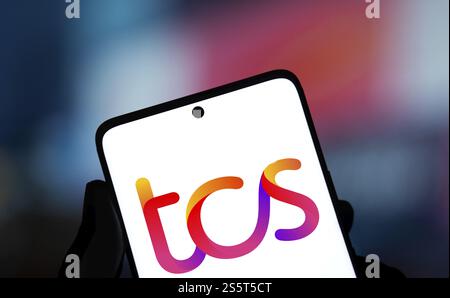 Tcs logo is displayed on smartphone. Tata Consultancy Services (TCS) is ...