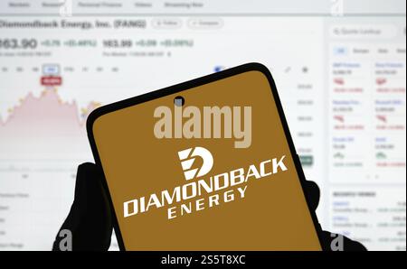 Diamond back energy logo is displayed on smartphone. Diamondback Energy ...
