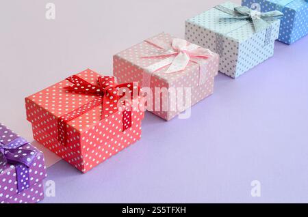 Different gift boxes on red background, top view Stock Photo - Alamy