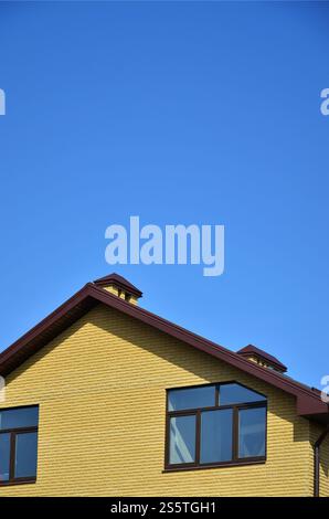 A residential building against the background of the sky with a rainbow ...