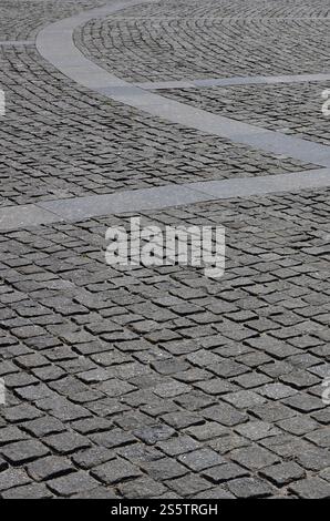 The texture of the paving slab (paving stones) of many small stones of ...