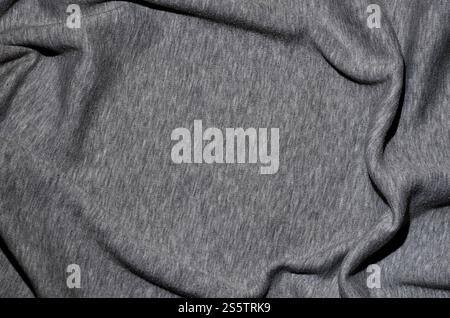 Close-up of rumpled heater and knitted sport jersey or hoodie fabric ...