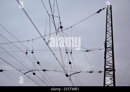 Railroad overhead lines against clear blue sky, Contact wire. High ...