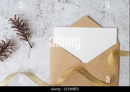 A blank card with envelope and leaf is placed on white background Stock ...