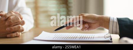 Man signing medical insurance contract Stock Photo - Alamy