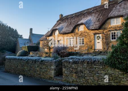 Thatched cottages in the frost. Ebrington, Chipping Campden, Cotswolds ...