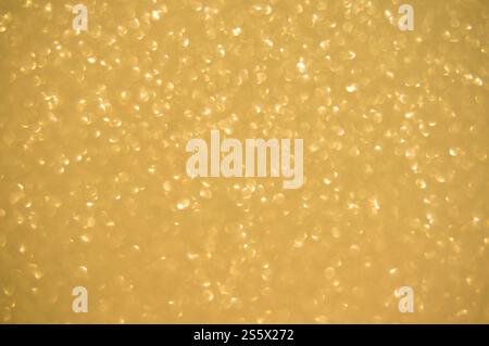 Gold glitters background. shimmering blur spot lights Bokeh Shiny gold ...