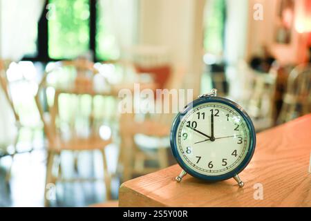 Alarm clock on table in room. Black Friday time Stock Photo - Alamy