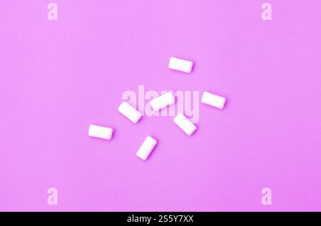Chewing gums on purple background Stock Photo - Alamy