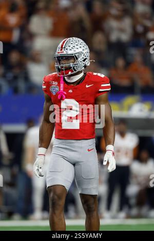 Ohio State defensive back Caleb Downs, right, celebrates after his ...