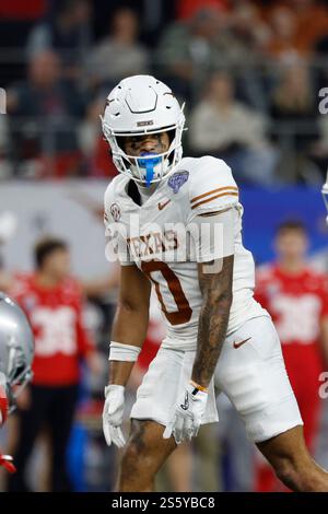 Texas wide receiver DeAndre Moore Jr. (0) plays catch with a young fan ...