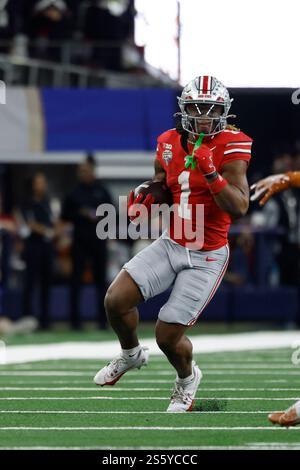 Ohio State running back Quinshon Judkins (1) carries the ball as he's ...