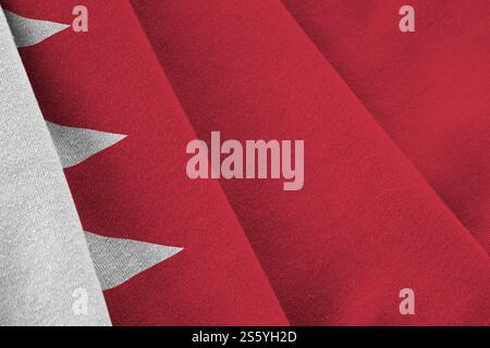 Bahrain flag with big folds waving close up under the studio light ...