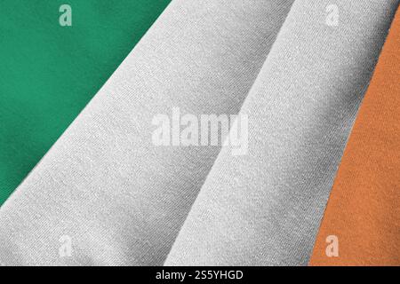 Ireland flag with big folds waving close up under the studio light ...