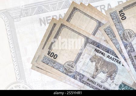 500 Nepalese rupees bills lies in stack on background of big semi ...
