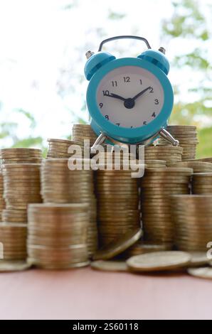 Close Up of Clock on Blue Background Stock Photo - Alamy