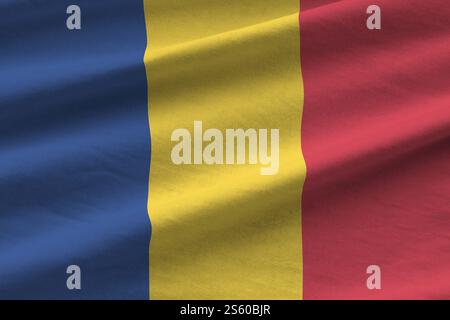 Romania flag with big folds waving close up under the studio light ...