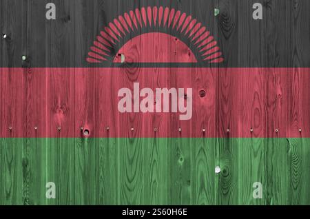 Malawi flag depicted in bright paint colors on old wooden wall close up ...