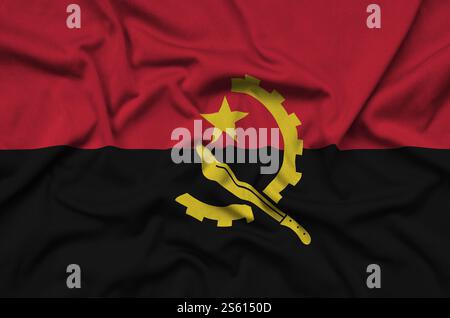 Angola flag is depicted on a sports cloth fabric with many folds. Sport ...