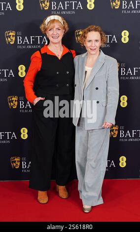 Sara Putt, left, and Anna Higgs pose for photographers following the ...