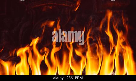 Flames in fireplace. Texture background isolated on a black background ...