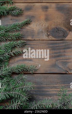 Evergreen tree twig on vintage wooden board Stock Photo - Alamy
