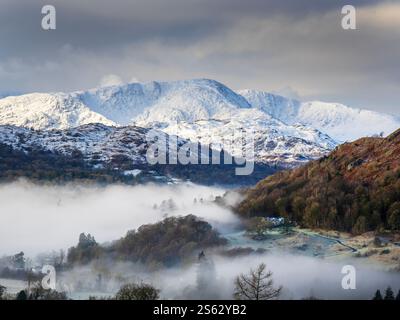 Snow on Wetherlam with valley mist from Ambleside, Lake District, UK ...