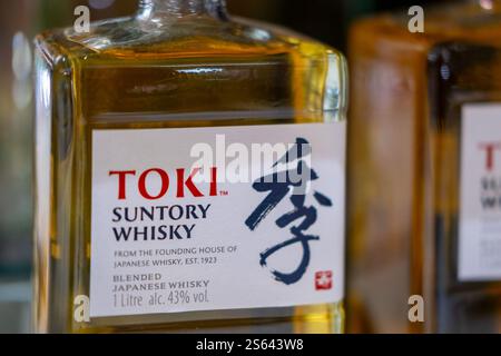 commercial-style product shot Suntory Toki whisky bottles, premium ...