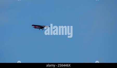 ICP MXP-740 Savannah, a red fixed-wing monoplane, descending to land in ...