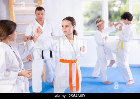 Young pupils train to perform defensive karate installations and ...