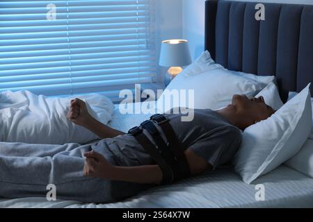 Man in sleepwalking condition screaming on bed Stock Photo - Alamy