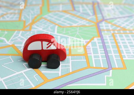Red toy car on map. Road trip Stock Photo - Alamy