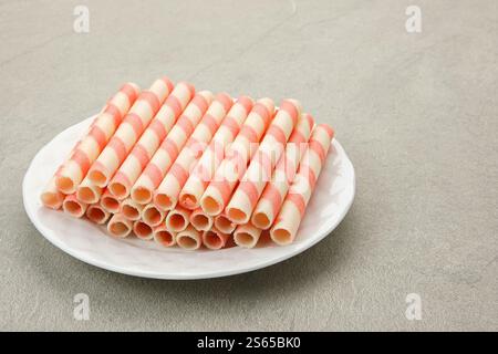 Strawberry wafer rolls or astor in white plate Stock Photo - Alamy