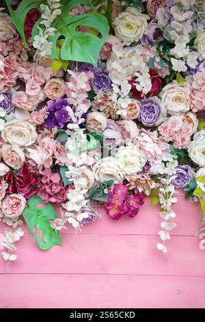 Colorful silk artificial flowers background Stock Photo - Alamy