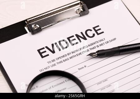 Evidence report blank on A4 tablet lies on office table with pen and ...