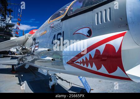 A fighter jet with the number 461 on the side. The jet has a red mouth ...