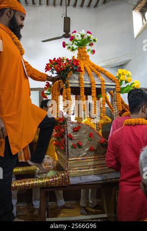 Volunteers of Ram Yuva Committee decorating Ram Dola (palanquin) for ...