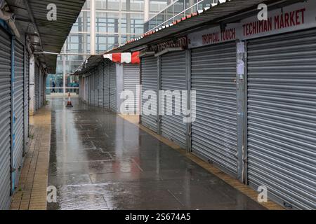 Closed and shuttered market stalls on a wet winter day, Open Air Market ...